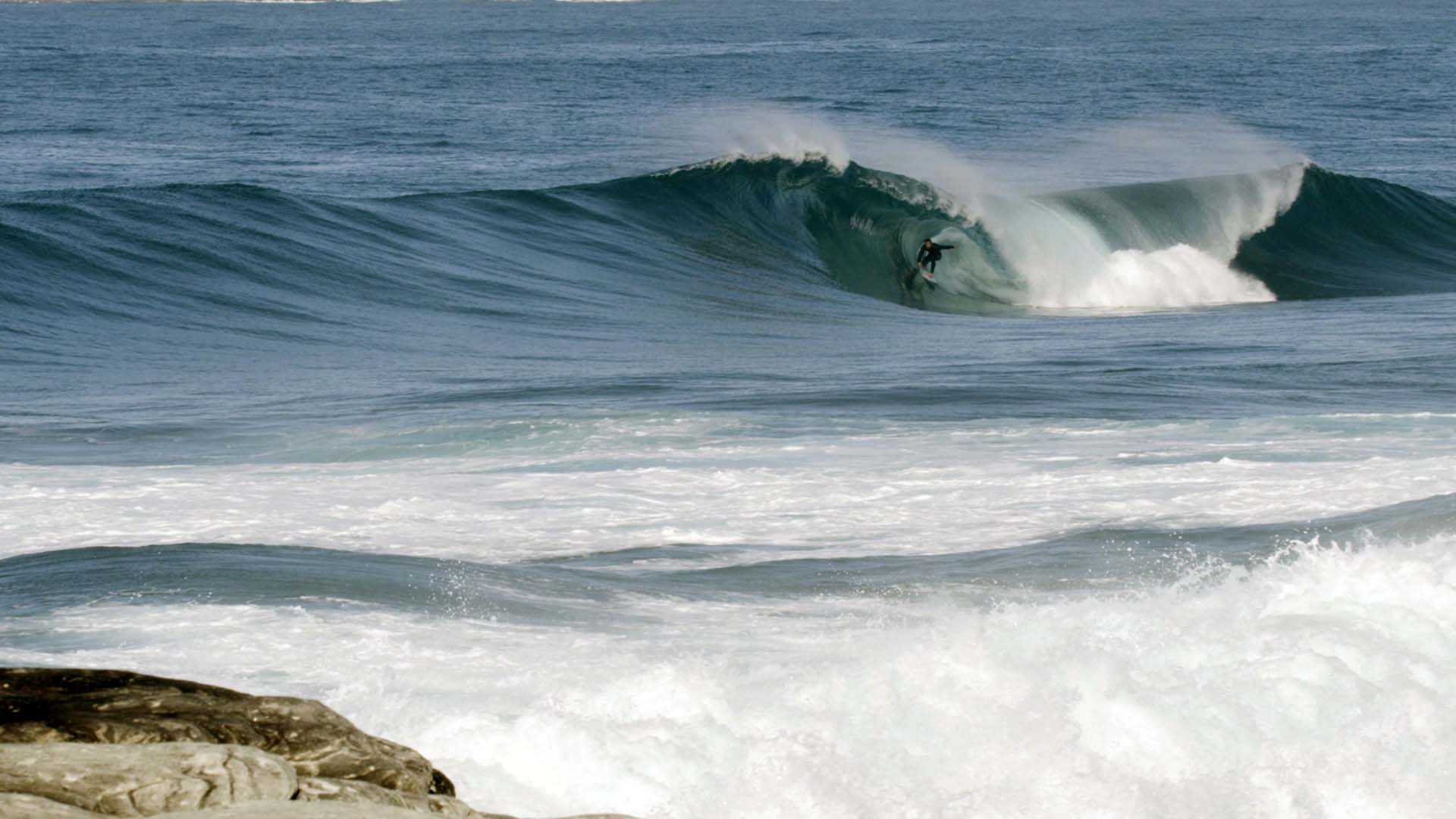 Video: Swell Hits Sand And Reef, Humans Caught In Middle